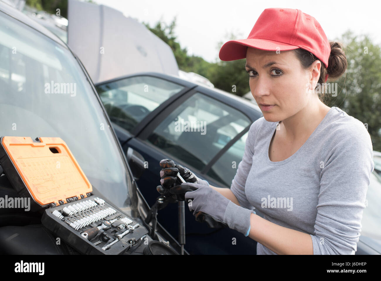 Female mechanic in scrap yard Stock Photo - Alamy