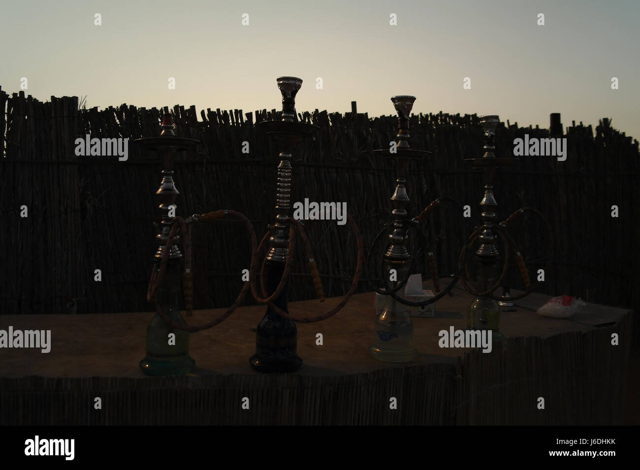 Evening twilight view four hookah, shisha, hubby-bubbly pipes standing ...