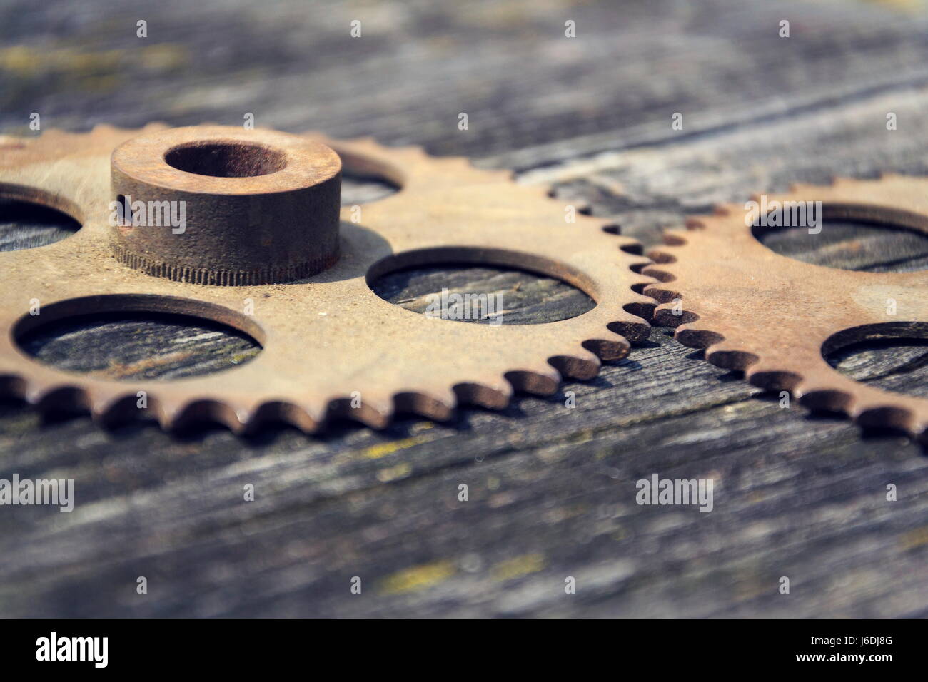 Filtered picture of cogwheels on a colorful wooden background Stock ...