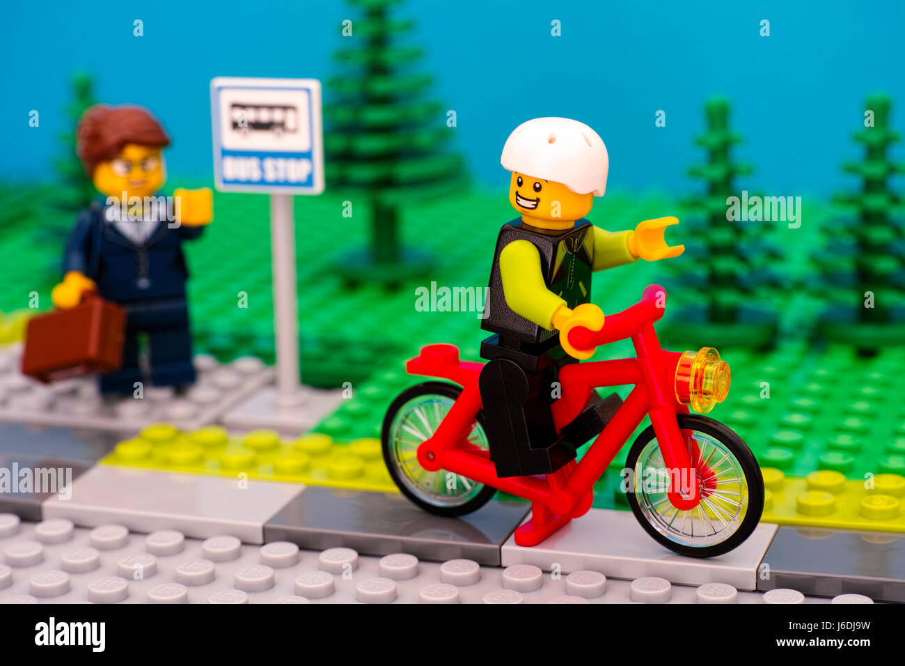 Man riding bike waving hi-res stock photography and images - Alamy