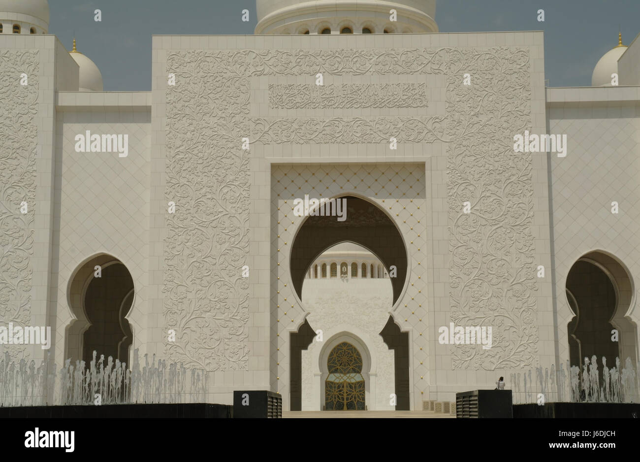 Water fountains at the top of the steps below the floral art archway ...