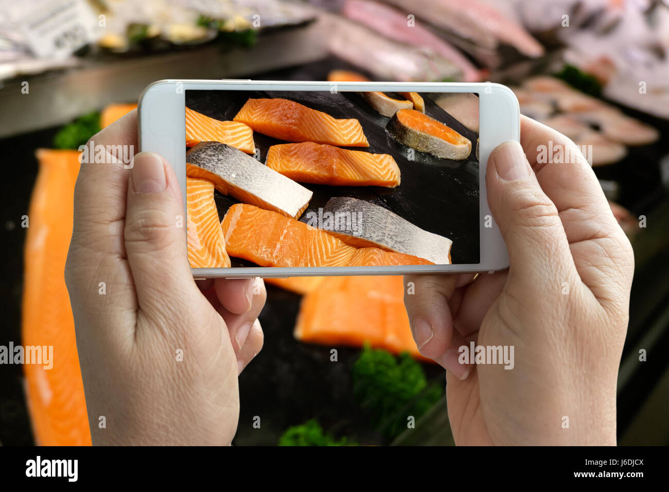 Selective focus on mobile phone screen , Hand holding smart phone and ...