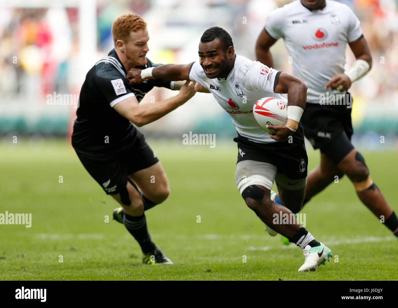 Fiji's Jerry Tuwai and New Zealand's Jamie Booth during day one of the ...