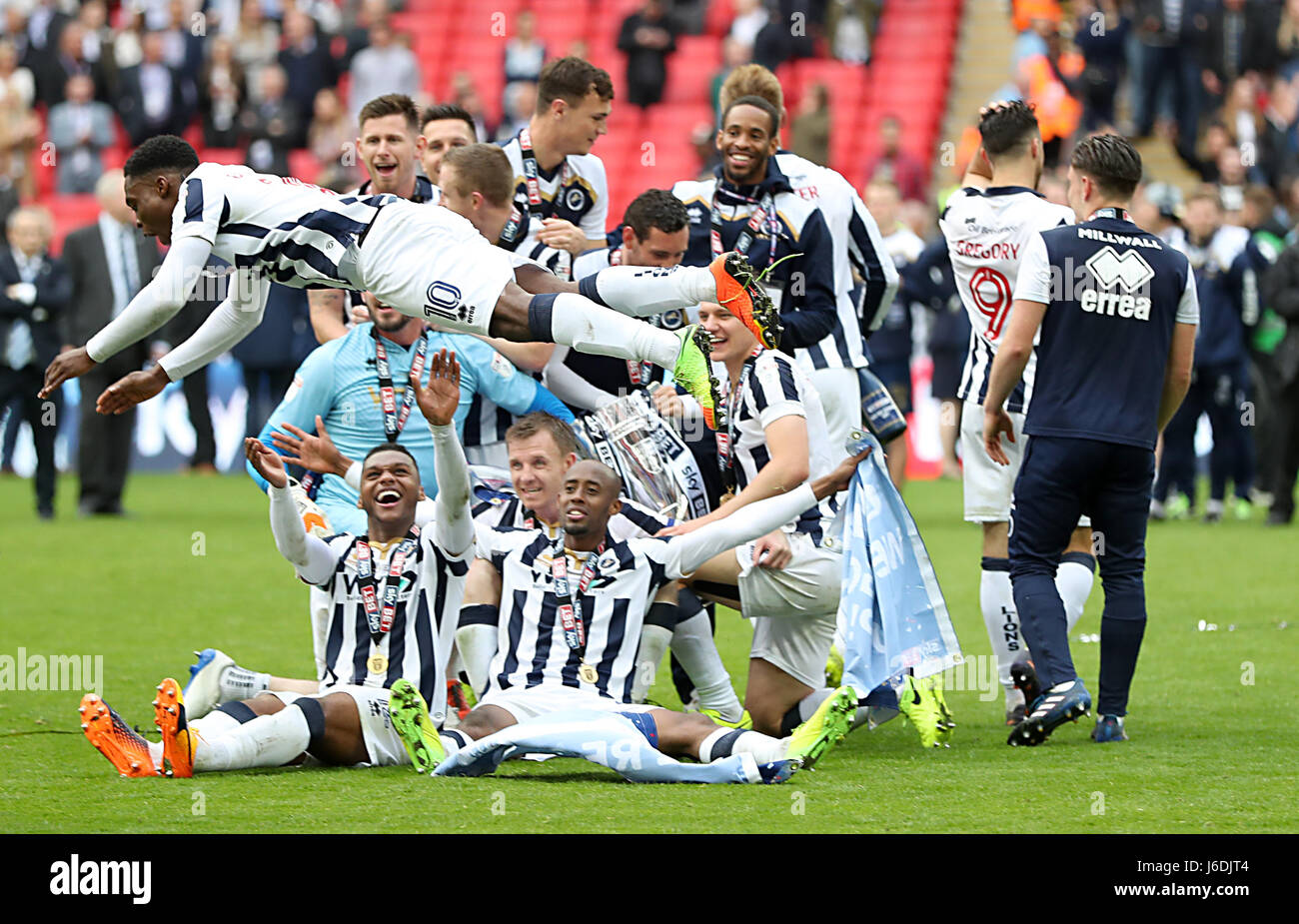 Millwall players celebrate on the pitch with the trophy after winning ...