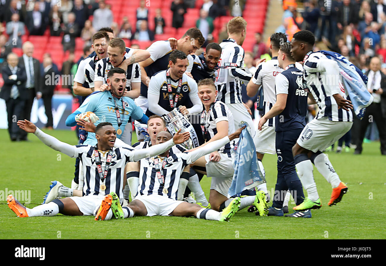 Millwall players celebrate on the pitch with the trophy after winning ...
