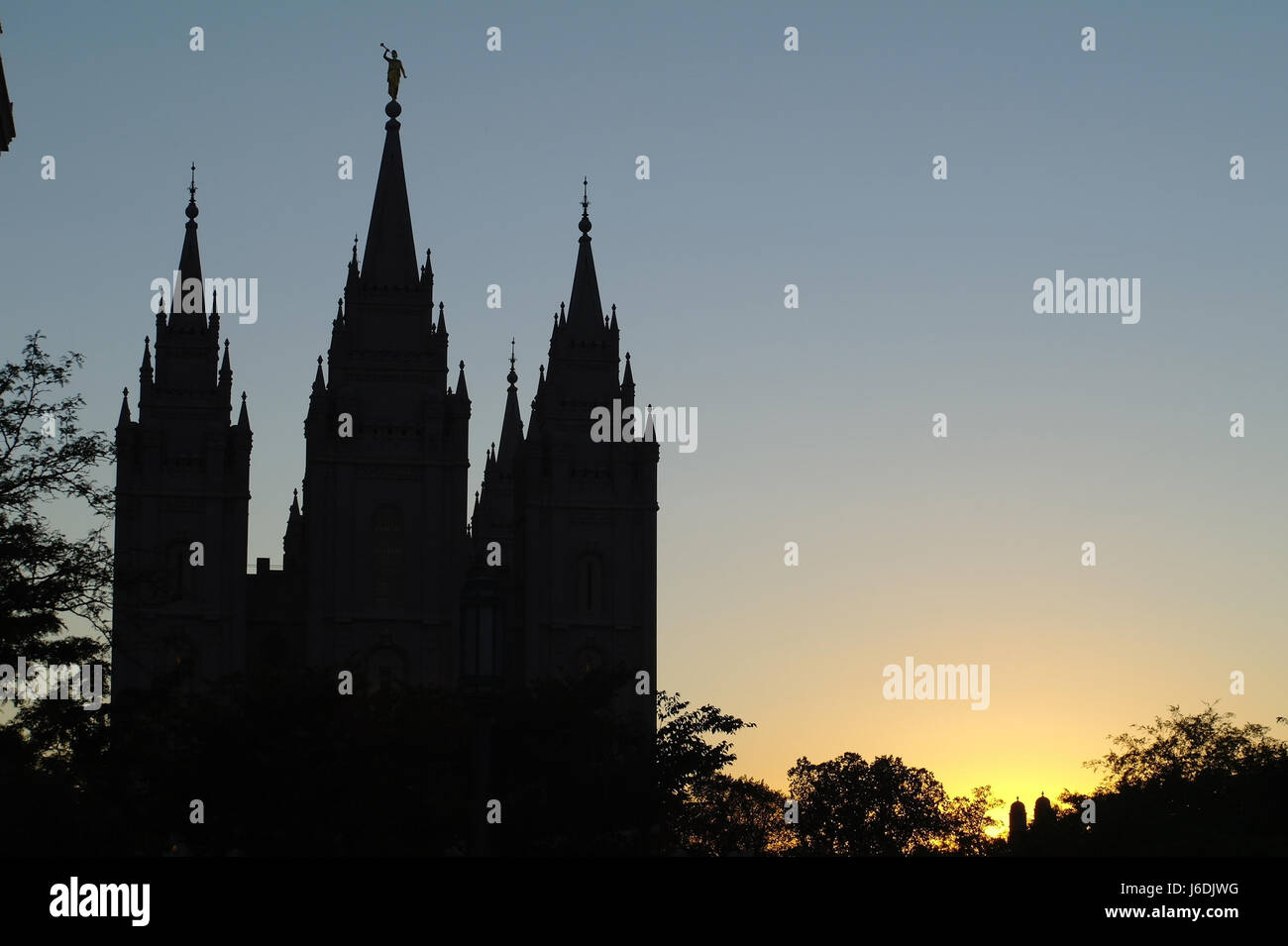 Blue sky yellow orange sunset silhouette view eastern facade Salt Lake ...