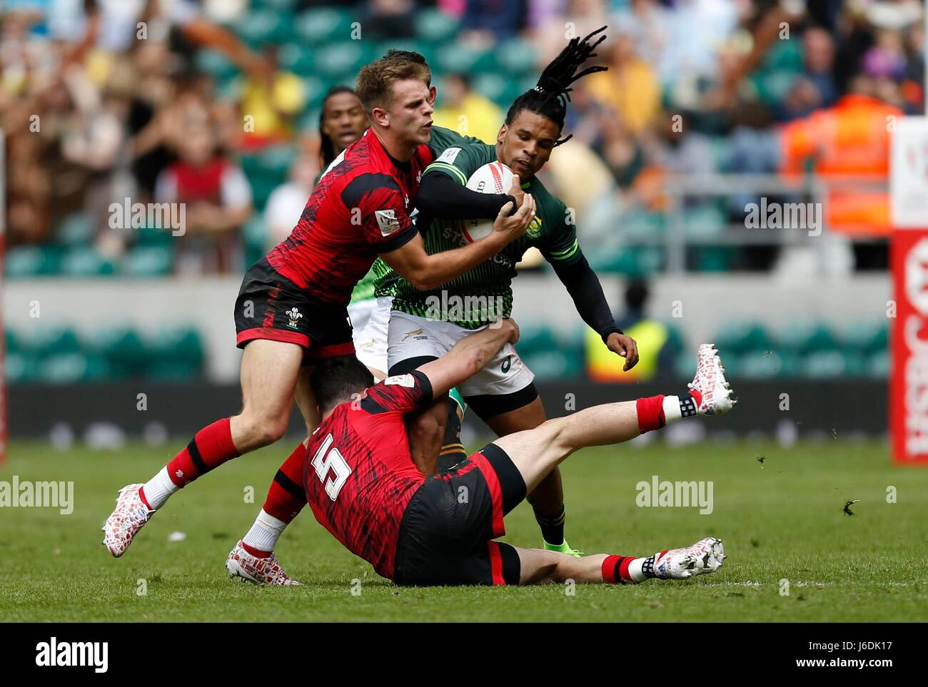South Africa's Rosko Specman is tackled by Wales' Owen Jenkins and ...