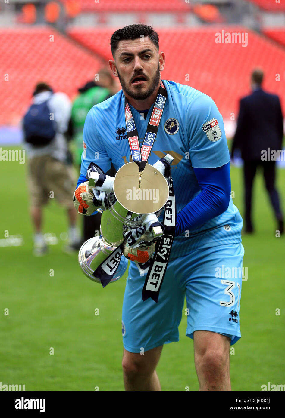 Millwall's Jordan Archer celebrates with the trophy after the Sky Bet ...
