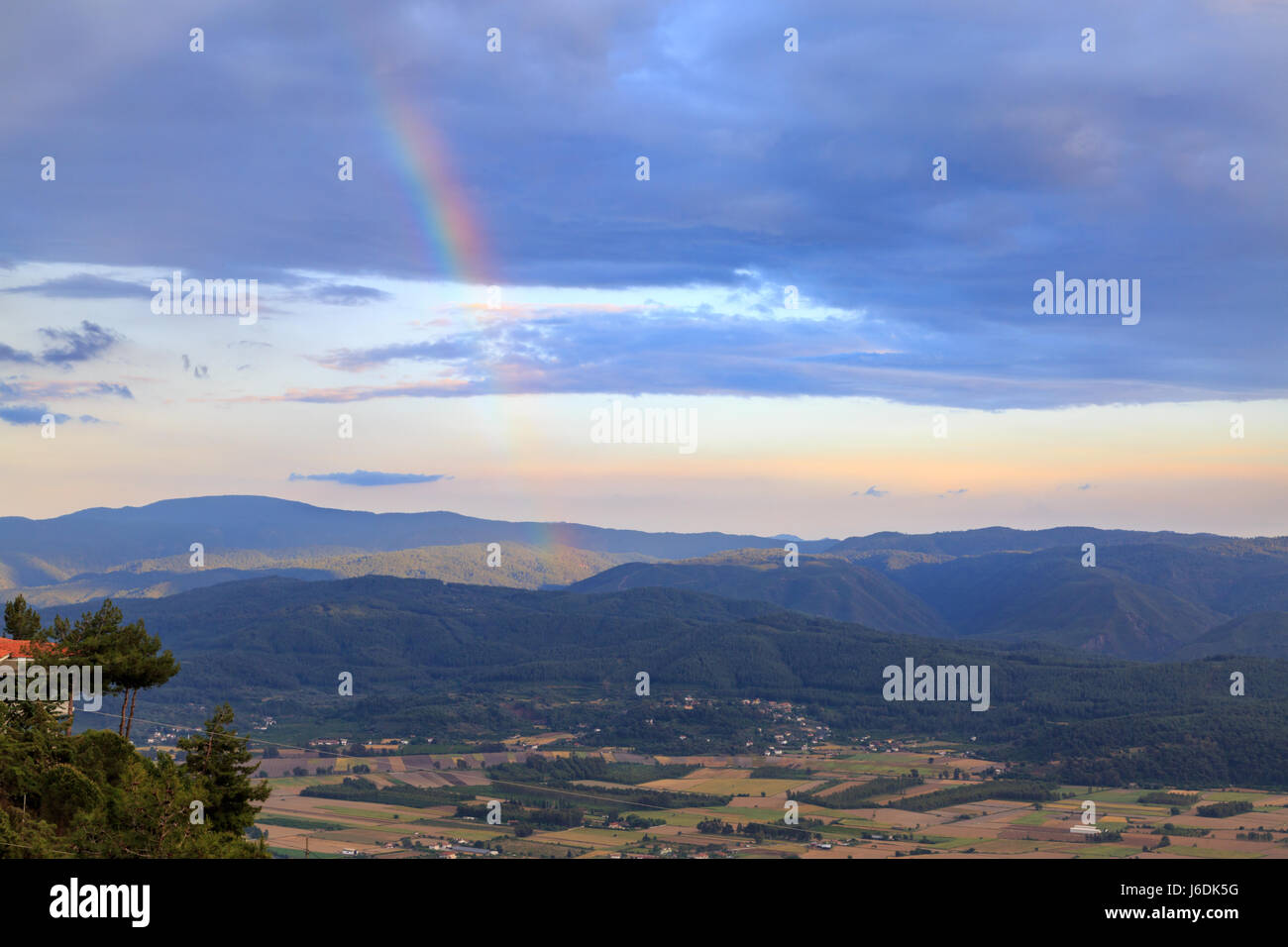 Rainbow on cloudy sky in sakar passage in mugla, turkey Stock Photo - Alamy
