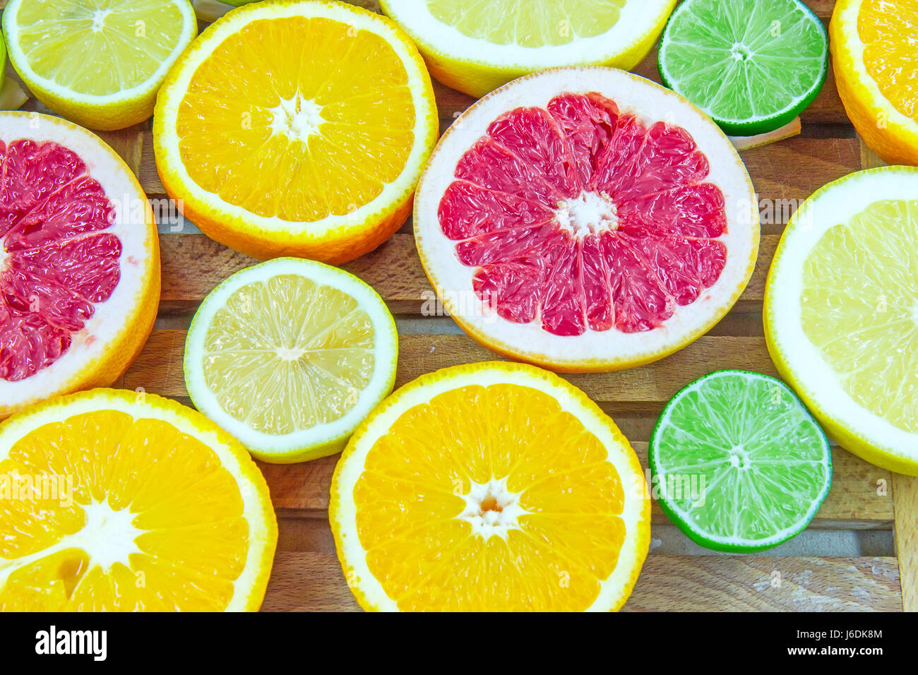 Fresh choped slices of different types of citrus Stock Photo - Alamy