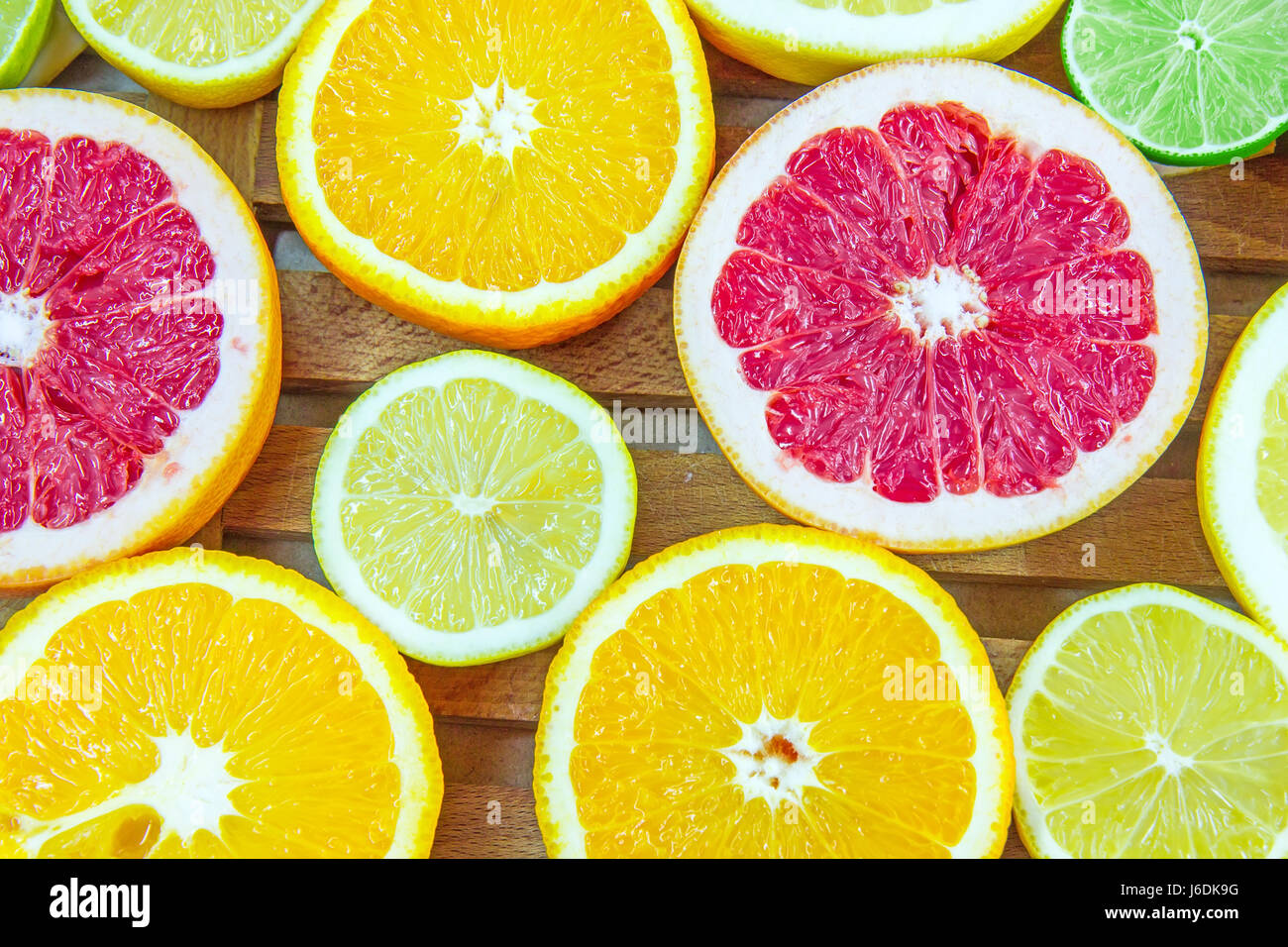 Fresh choped slices of different types of citrus Stock Photo - Alamy
