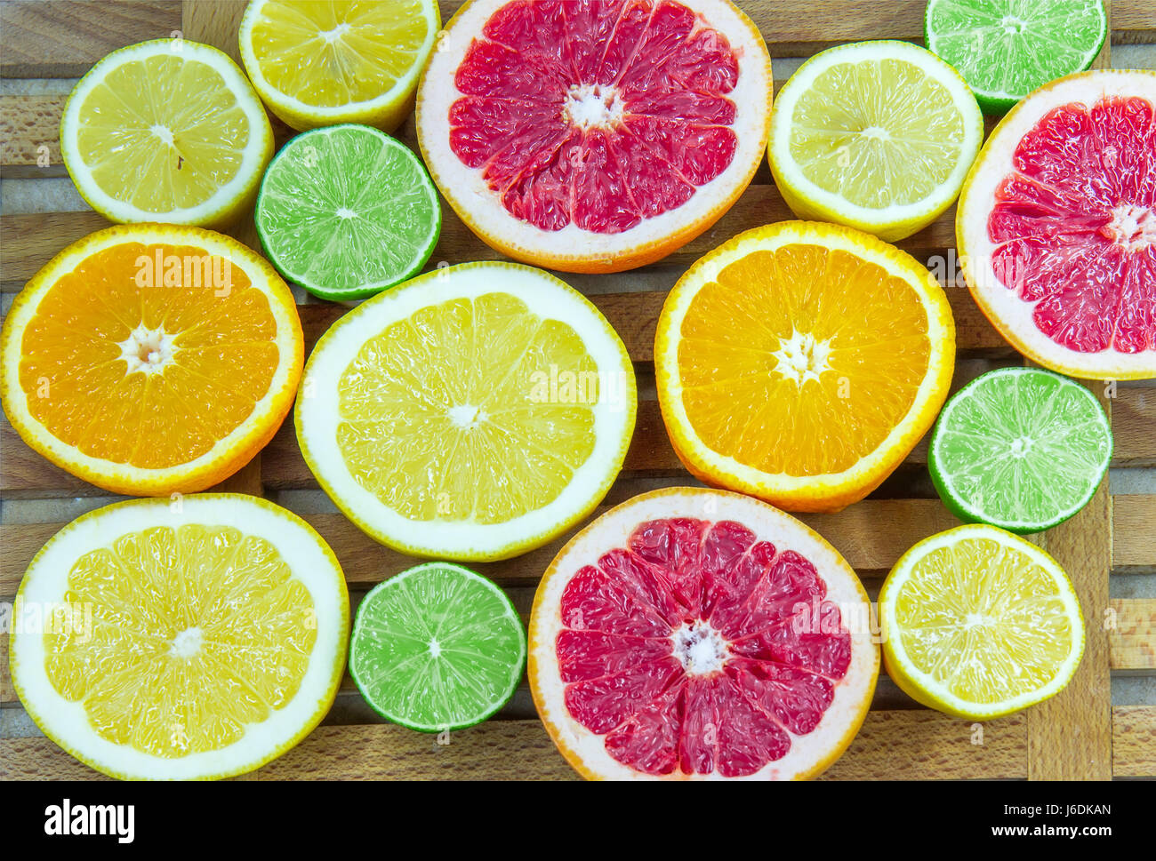 Fresh choped slices of different types of citrus Stock Photo - Alamy