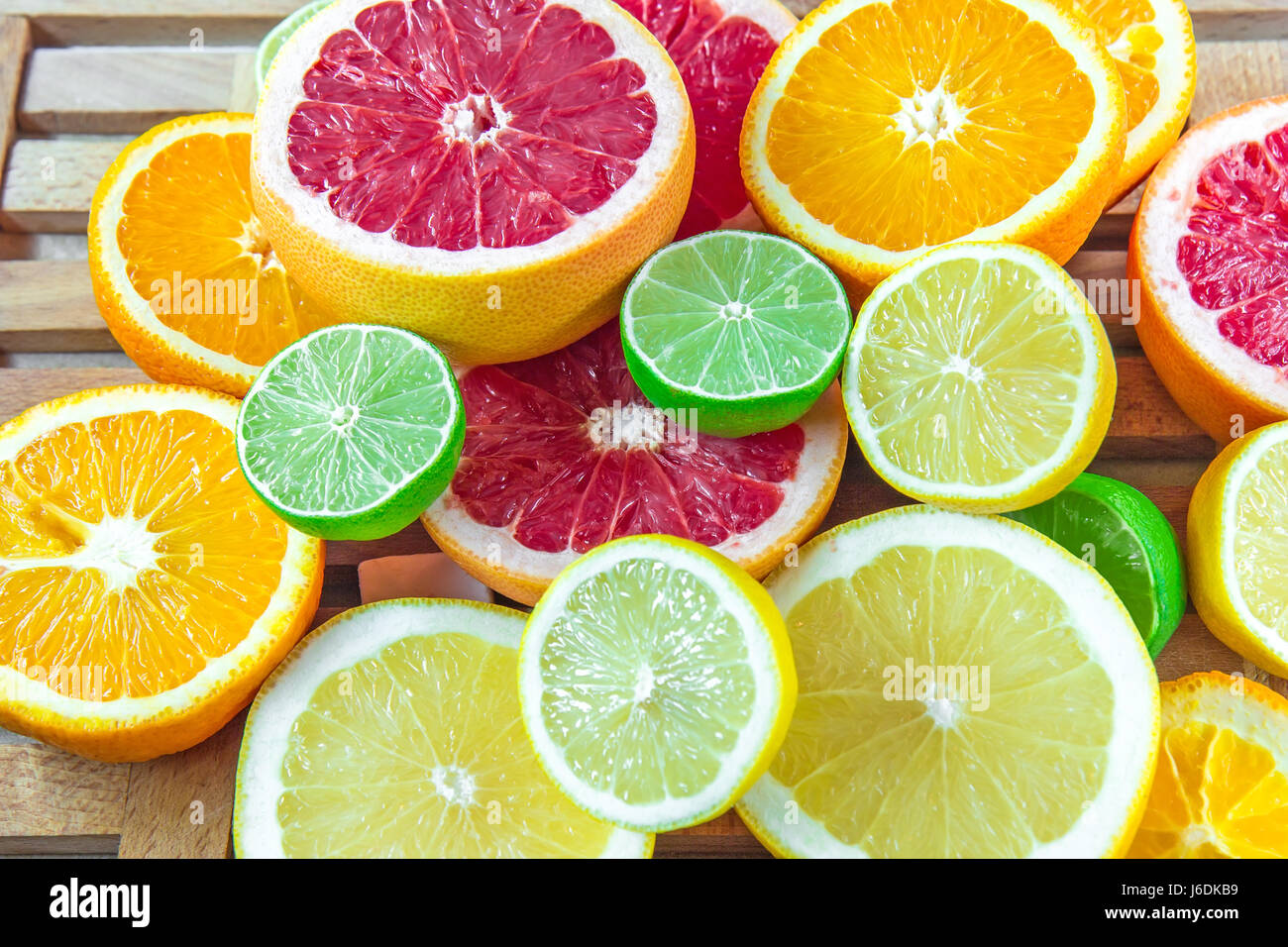 Fresh choped slices of different types of citrus Stock Photo - Alamy