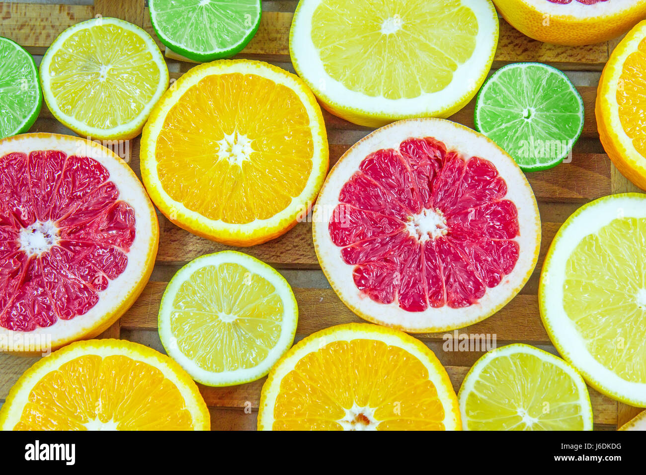 Fresh choped slices of different types of citrus Stock Photo - Alamy