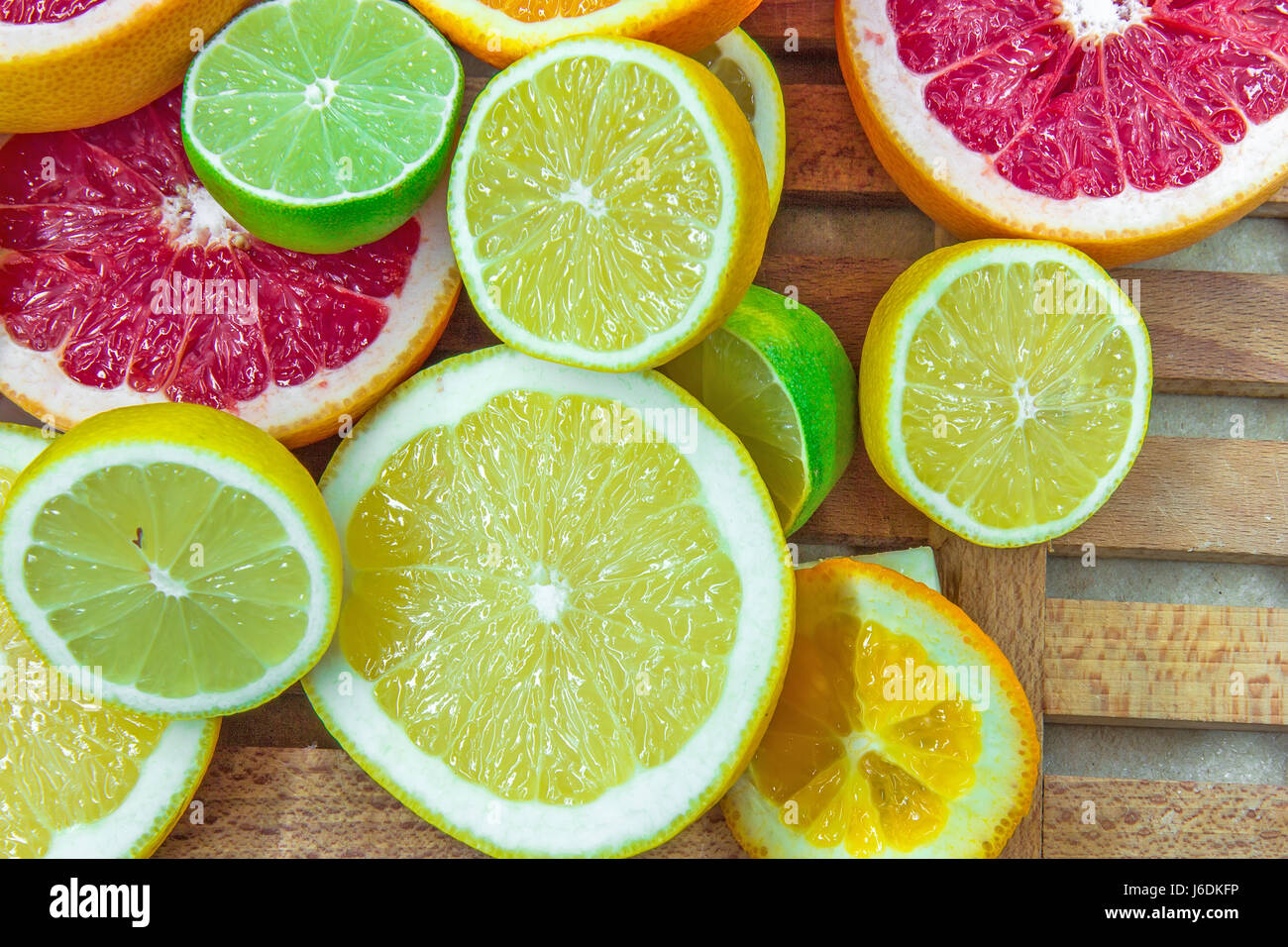 Fresh choped slices of different types of citrus Stock Photo - Alamy