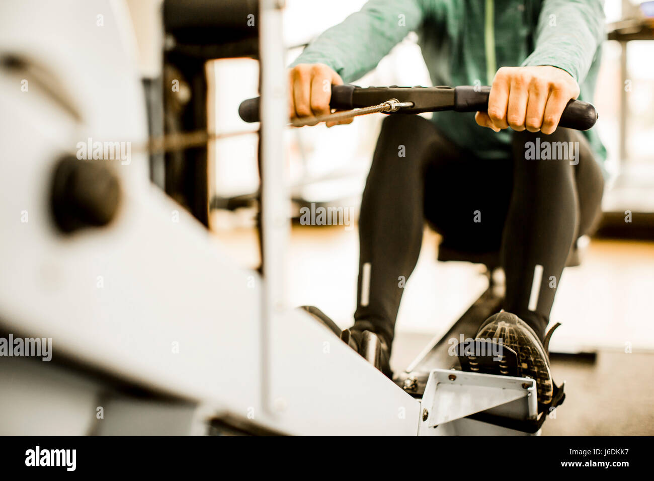 Male on rowing machine hi-res stock photography and images - Alamy