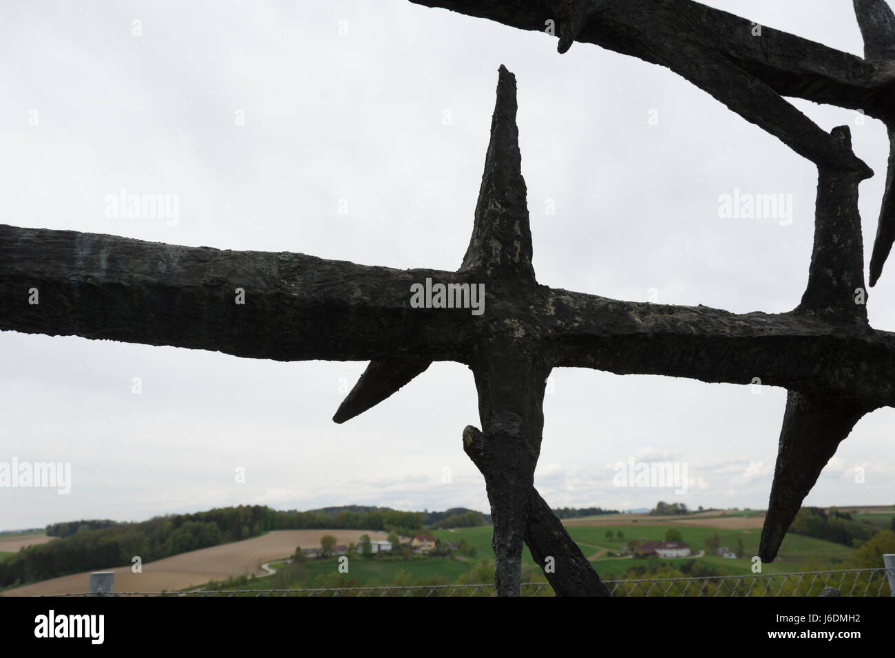 Mauthausen - Gusen concentration camp. Close up of arbed wire sculpture ...