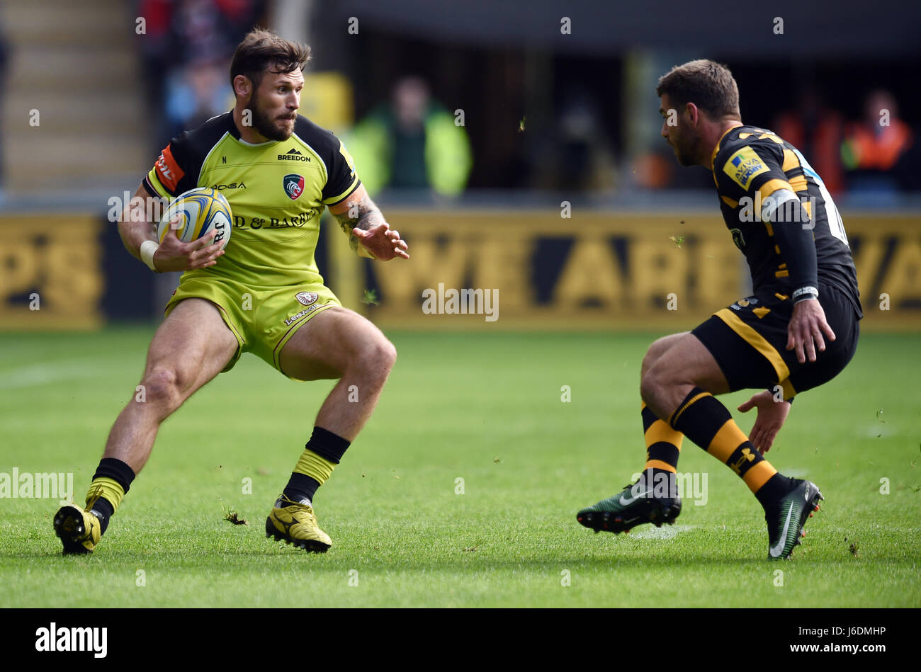 Leicester Tigers' Adam Thompstone (left) and Wasps' Willie le Roux ...