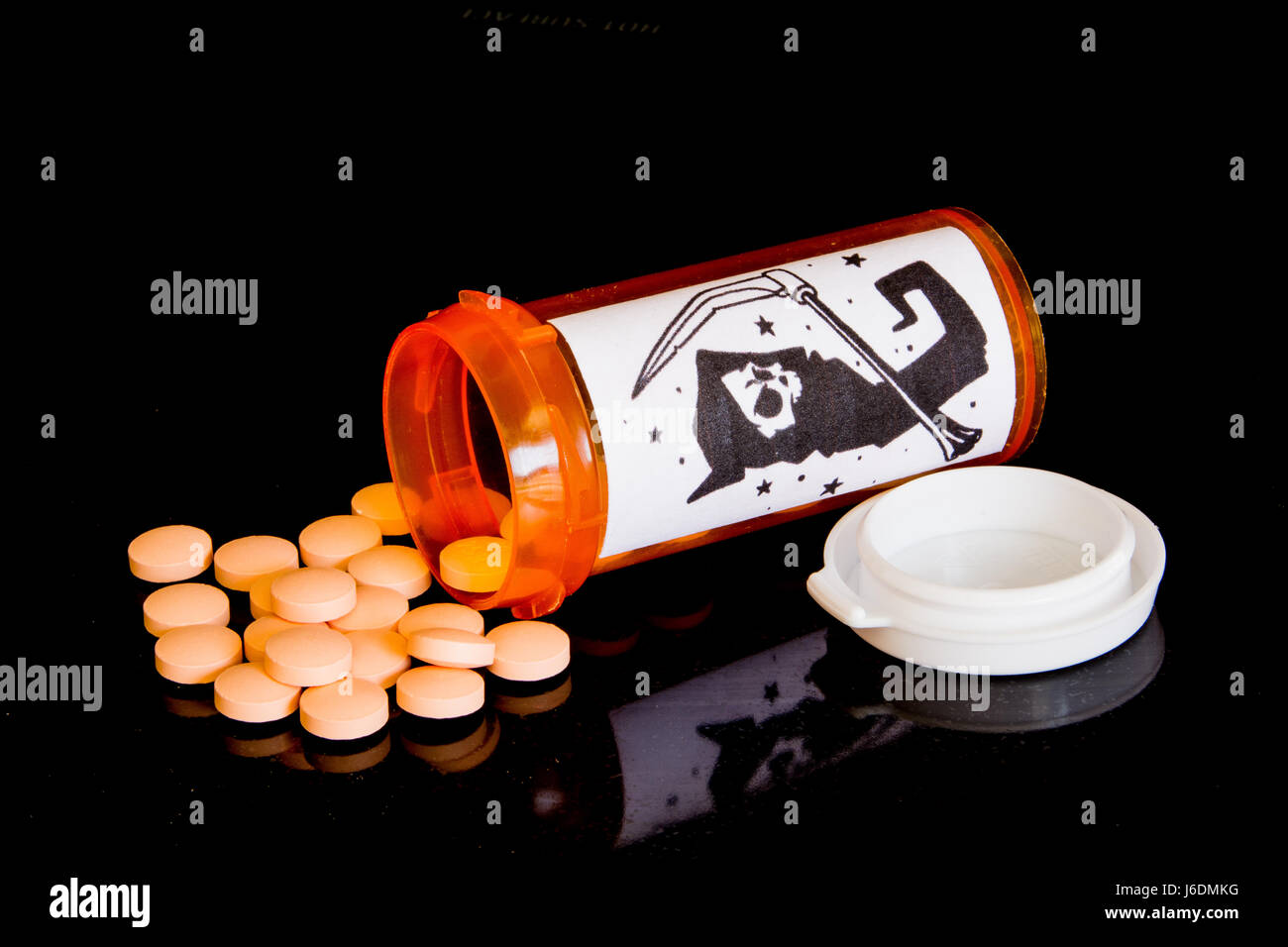 A vial of illegal drugs and the grim reaper Stock Photo - Alamy