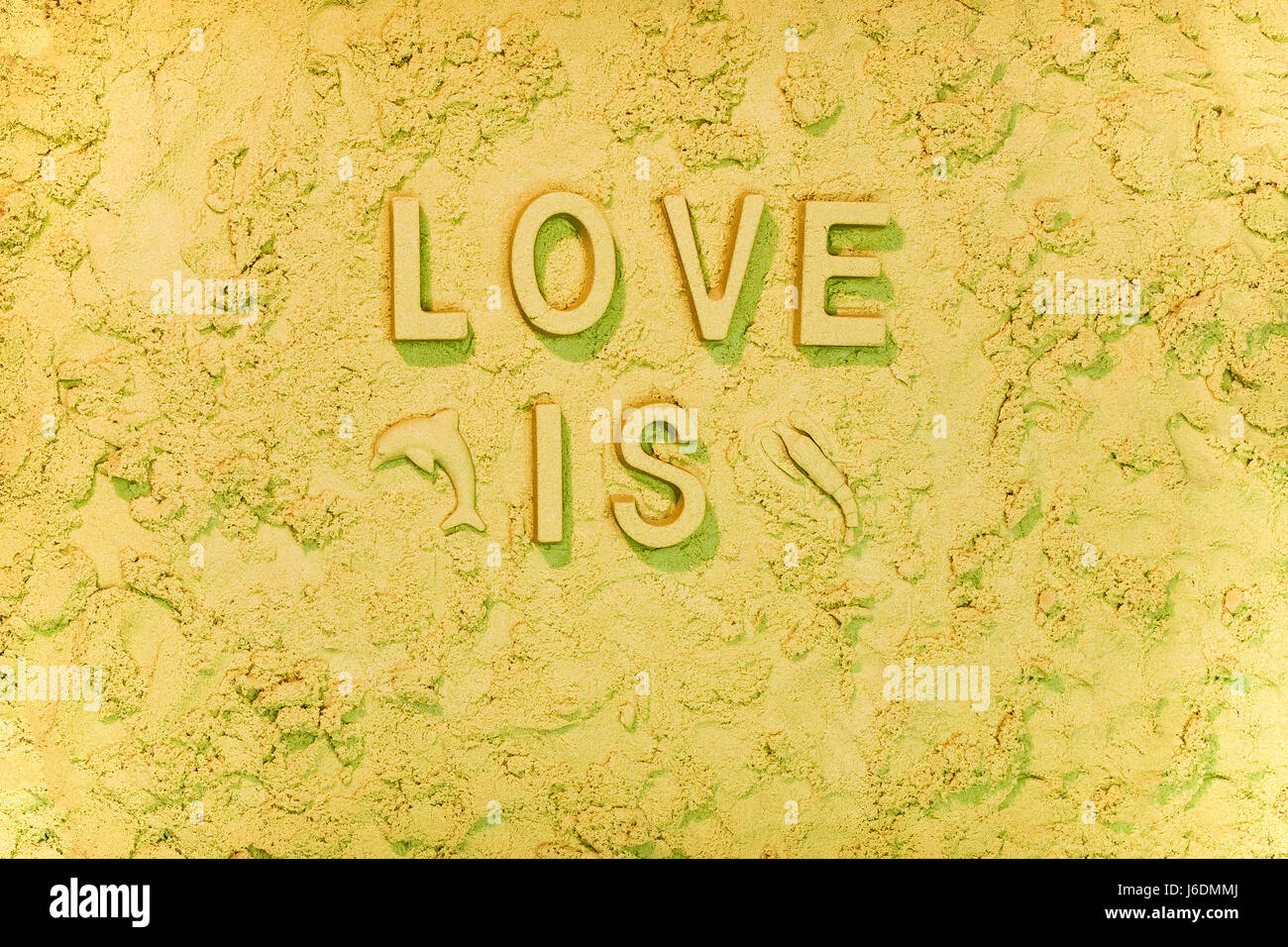 Love is the beach message in the sand Stock Photo - Alamy