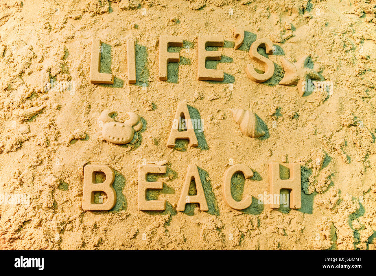 Life's a beach message in the sand Stock Photo - Alamy