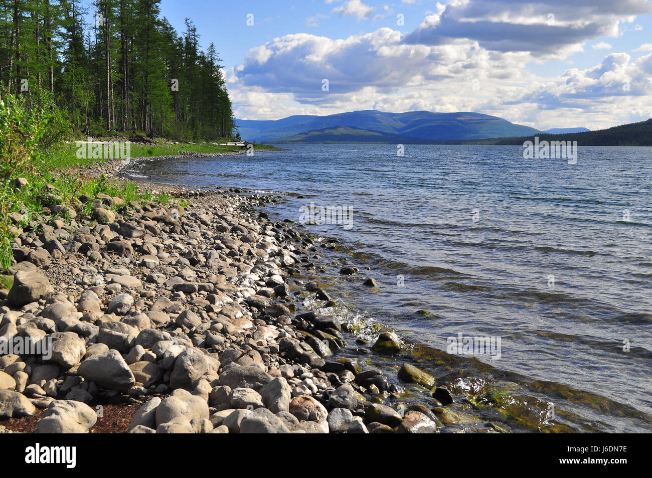 Skyline and sky reflection on the surface of the water hi-res stock ...