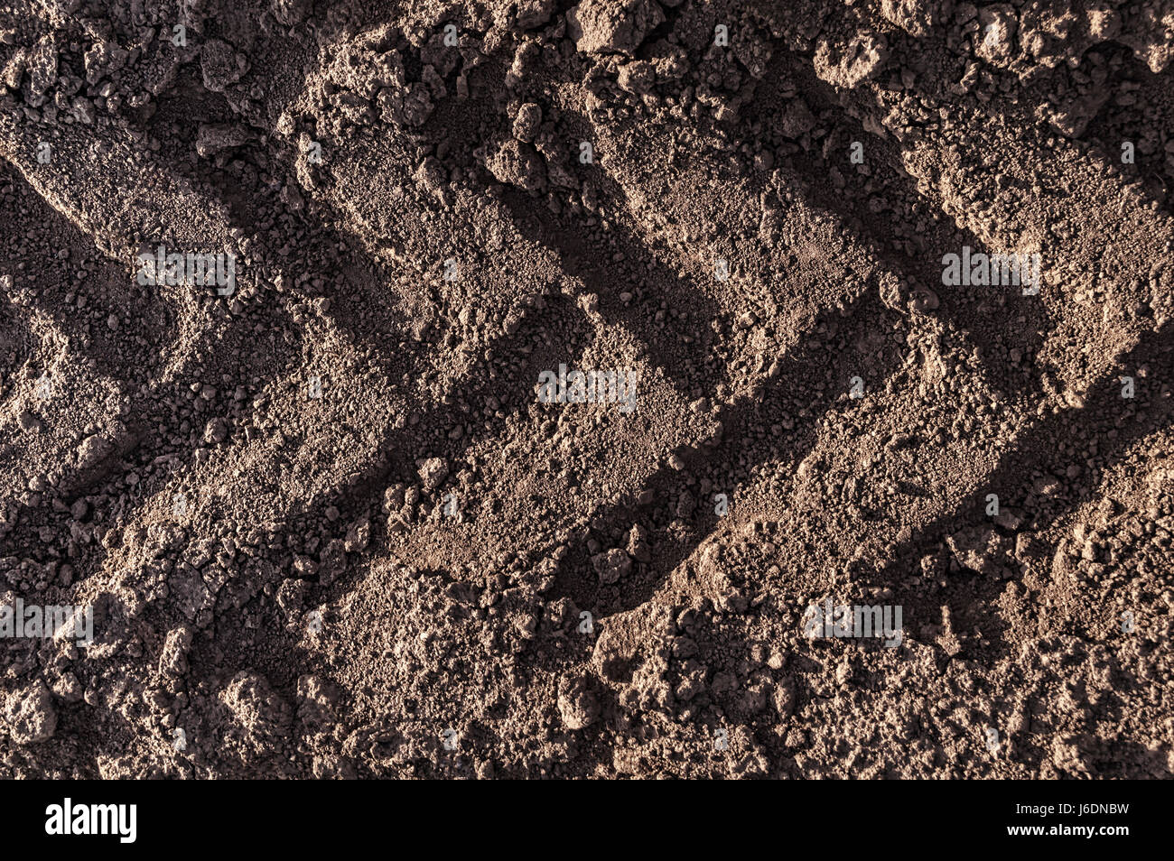 Agricultural tractor wheel tyre track on ploughed field Stock Photo - Alamy