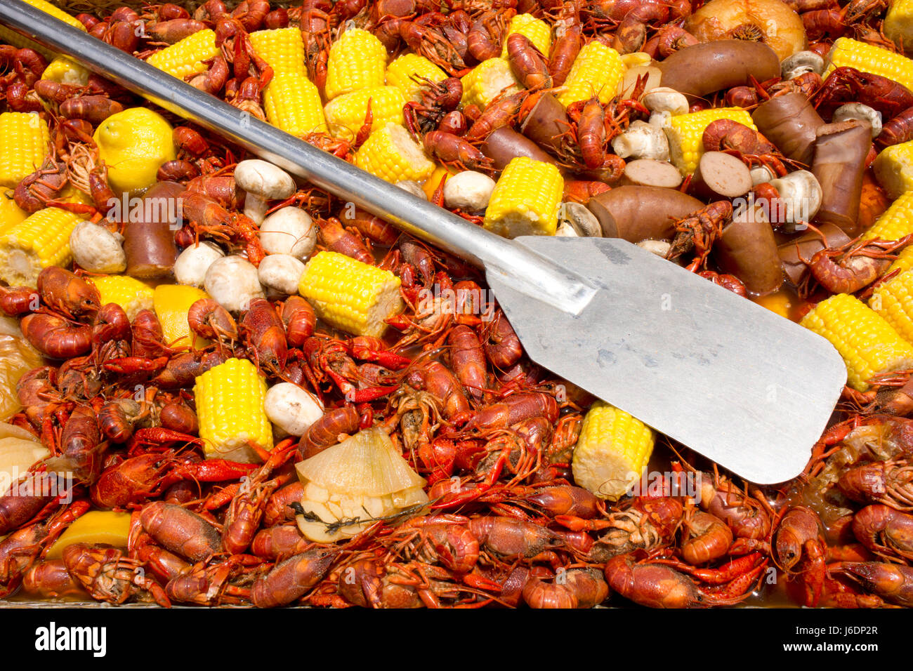 Boiled crayfish and corn on the cob in New Orleans. Southern cuisine ...