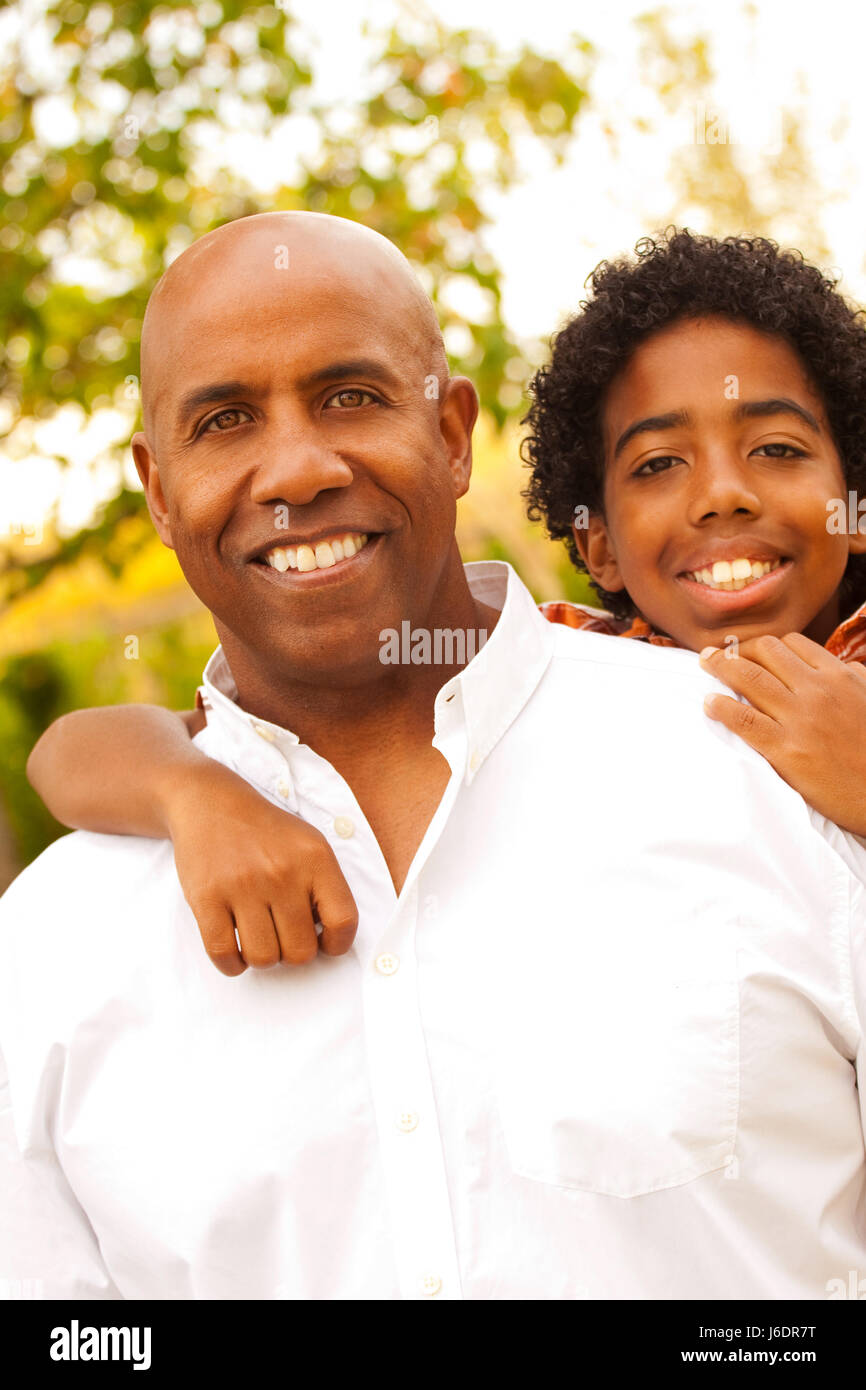 African American father and son talking and laughing Stock Photo - Alamy