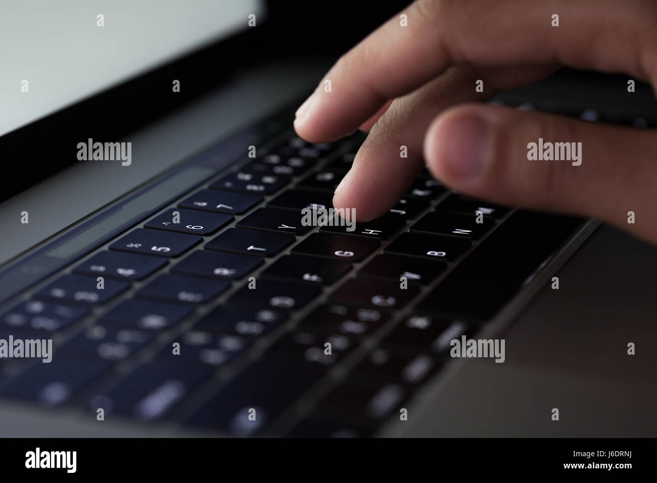 close-up finger typing on keyboard computer working at night Stock ...