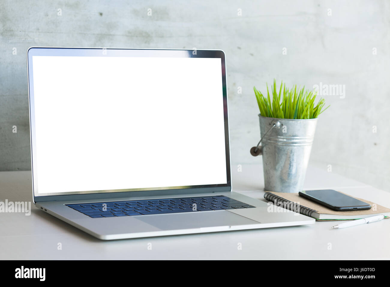 laptop computer on work desk showing white blank screen Stock Photo - Alamy