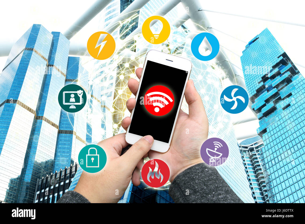 Smart Building and Internet of Things concept. Hand holding smartphone ...