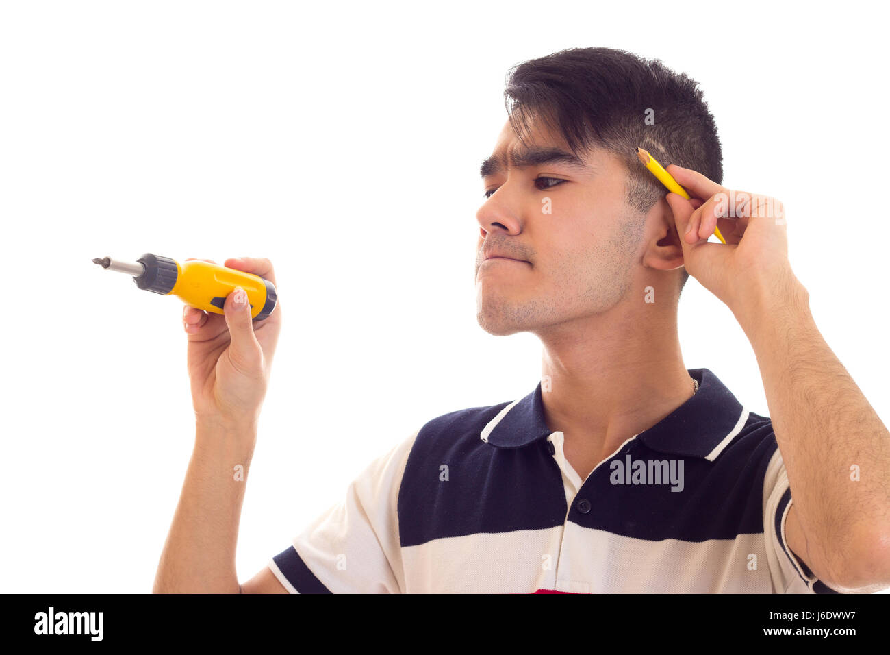 Young man holding a screwdriver Stock Photo - Alamy