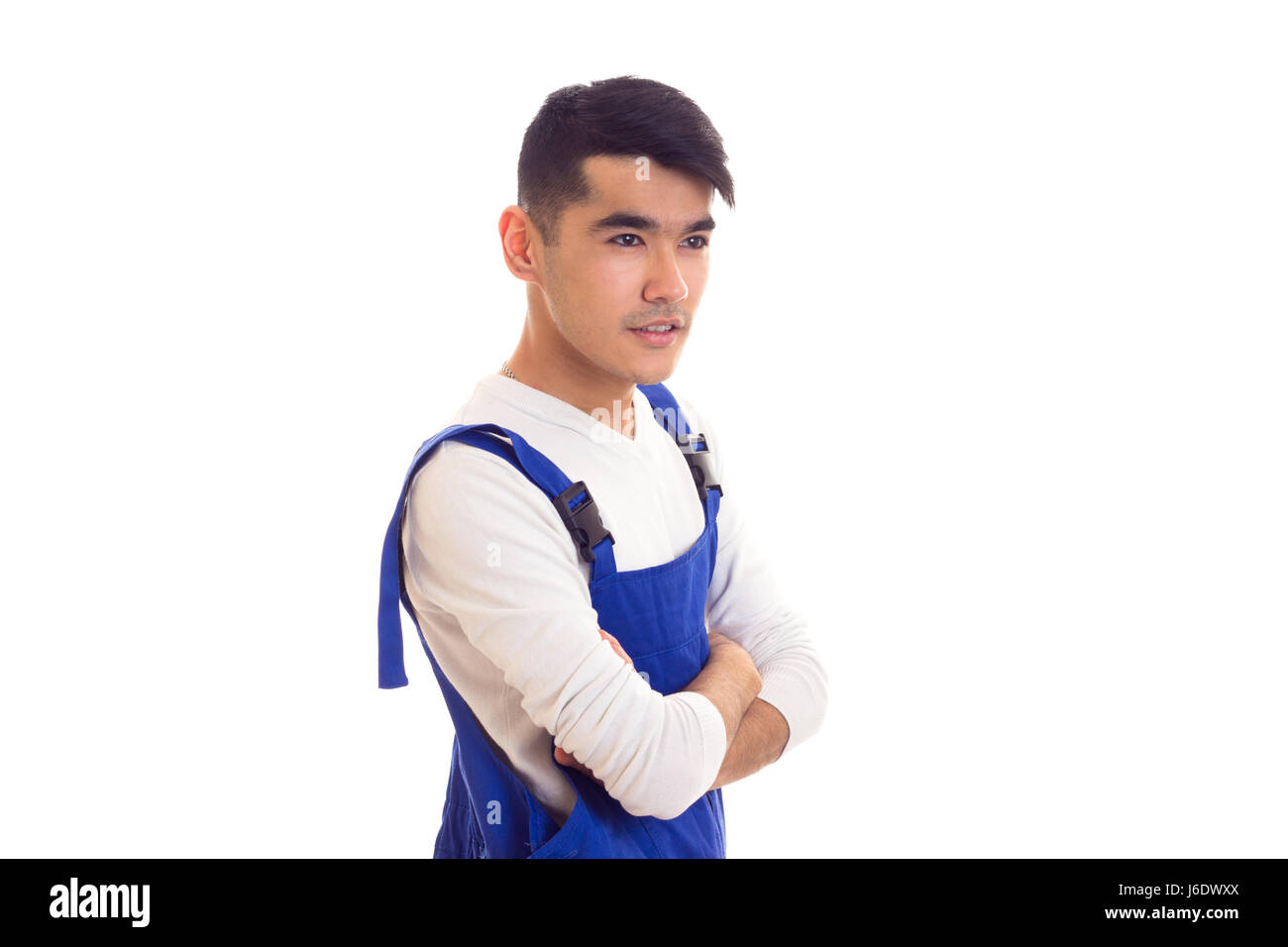 Young man in blue overall Stock Photo - Alamy