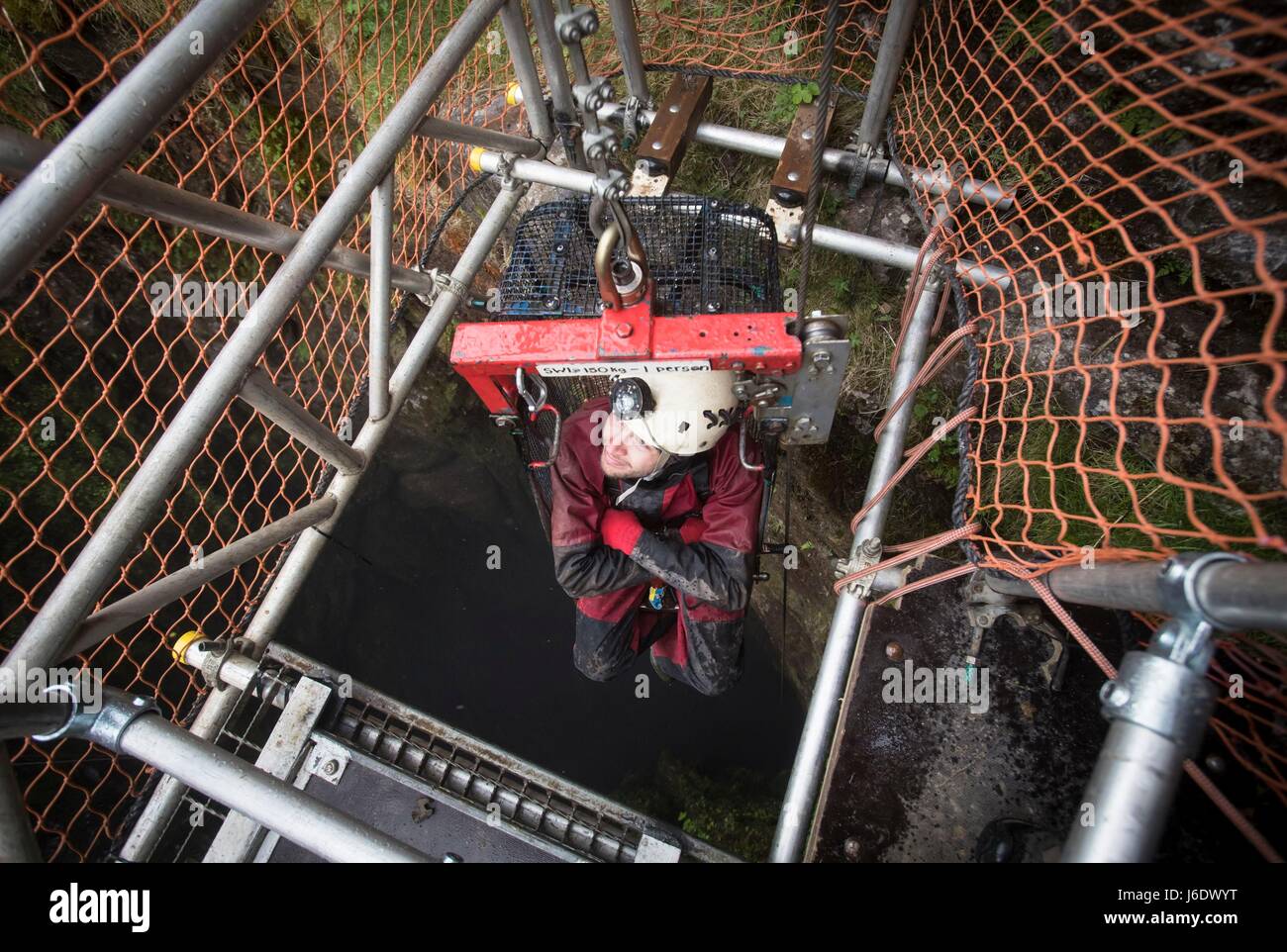A potholer is winched into Gaping Gill, the largest cavern in Britain ...
