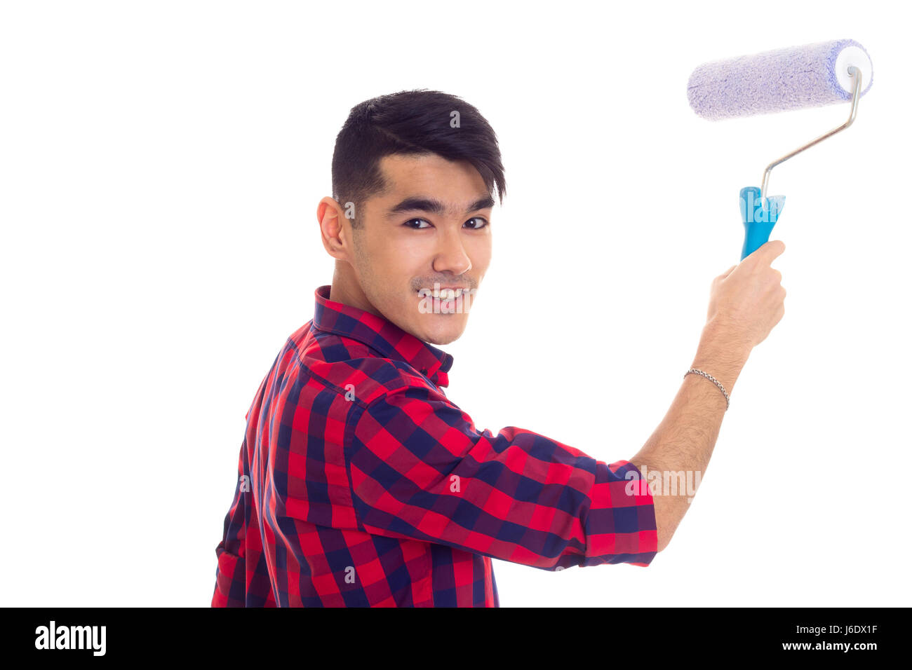 Young man using blue roll Stock Photo - Alamy