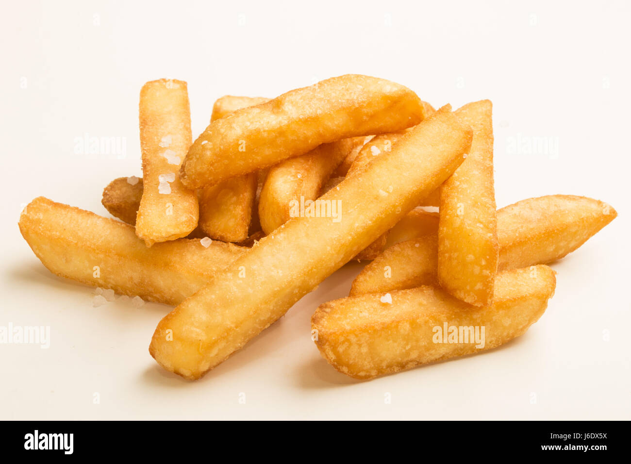 french fries with coarse salt on white background Stock Photo - Alamy