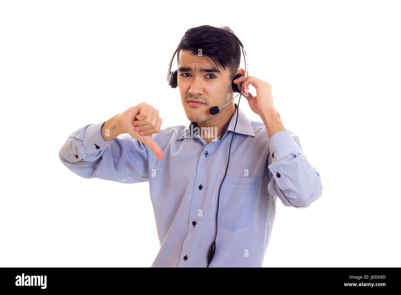 Young man using headphones Stock Photo - Alamy