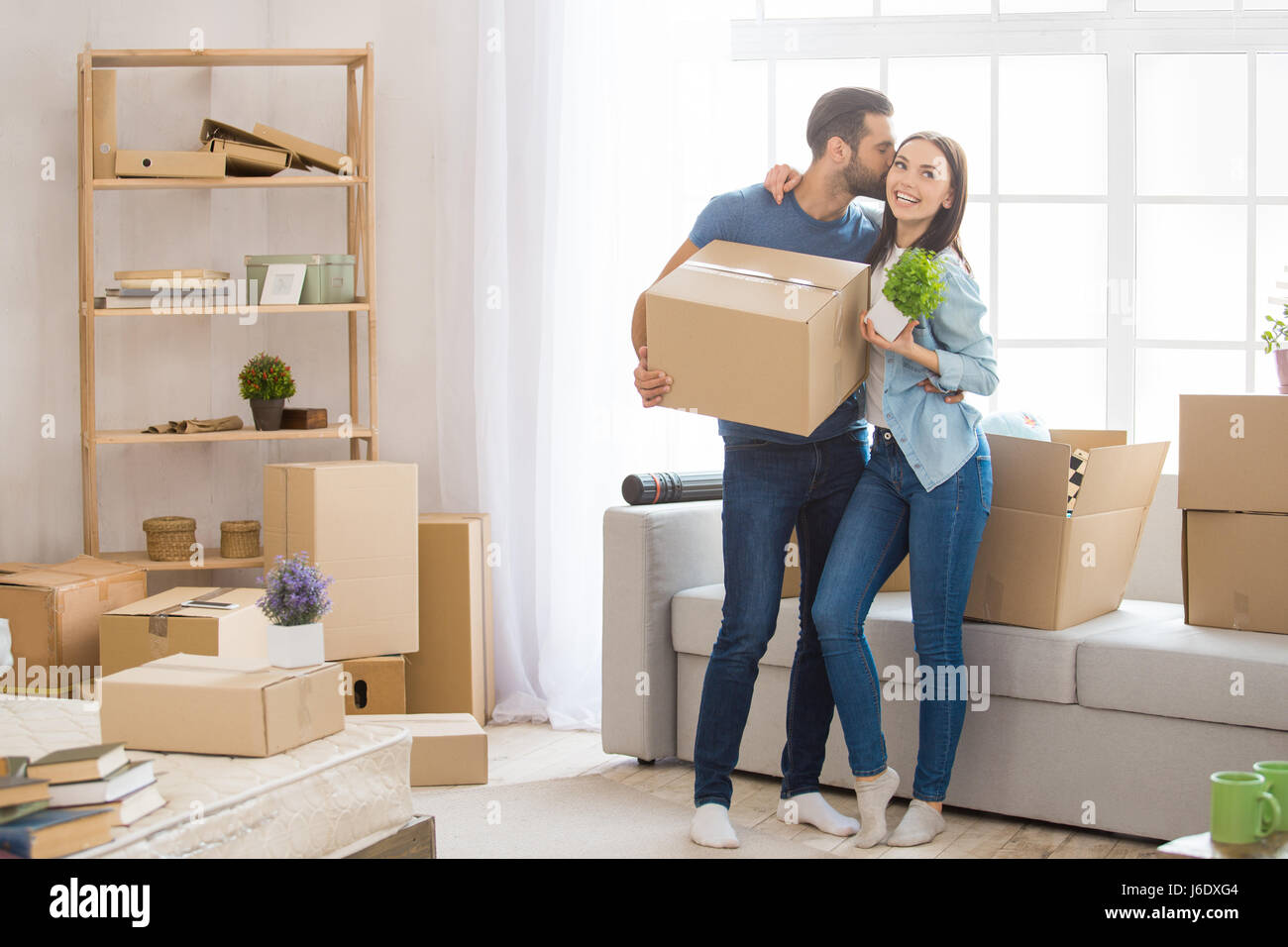 Young couple moving to a new apartment together relocation Stock Photo ...