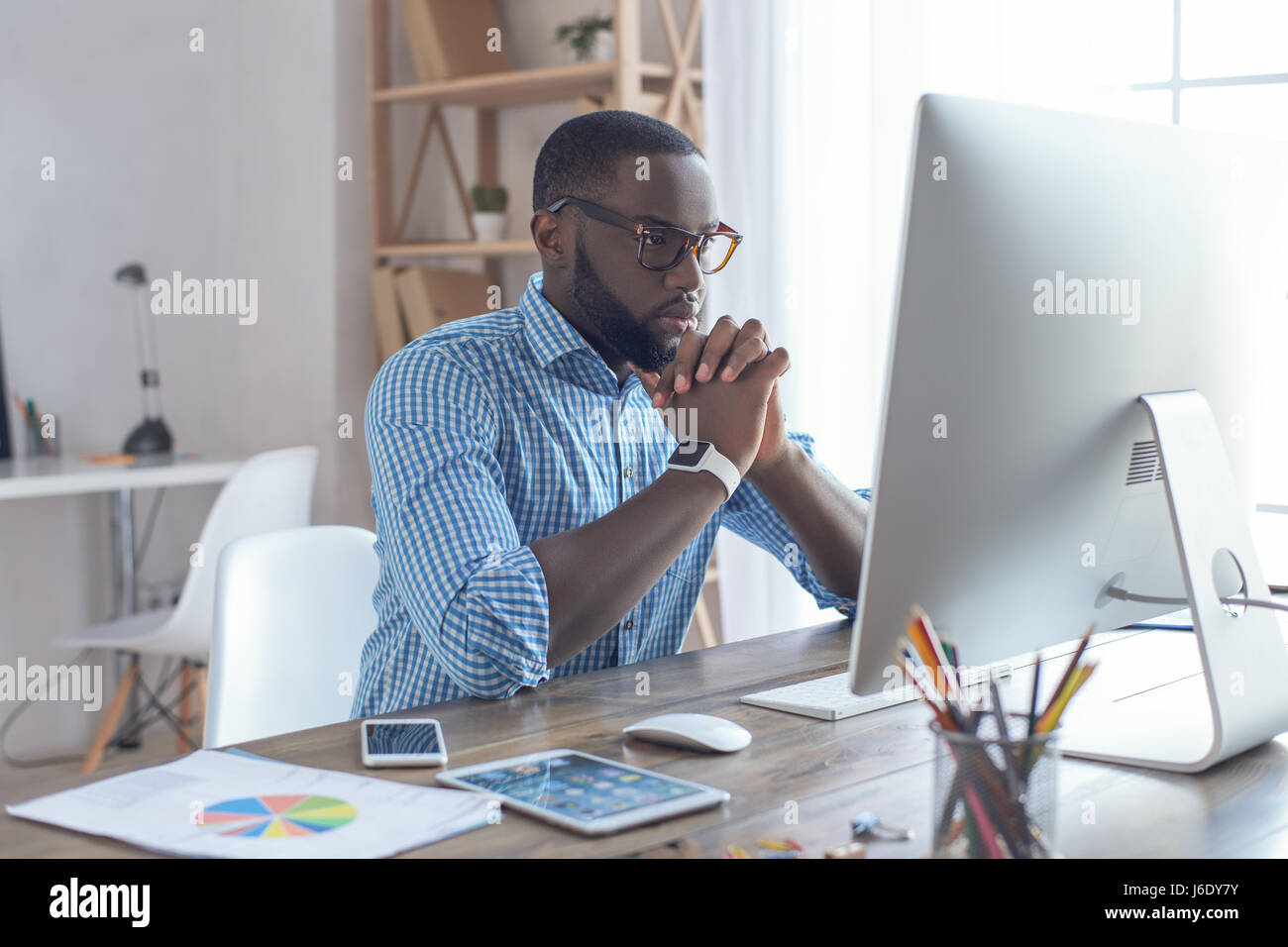 Young african man working in the office business Stock Photo - Alamy