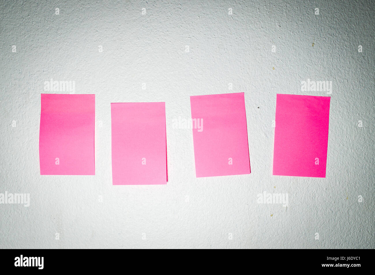 White paper notes on white wall hi-res stock photography and images - Alamy