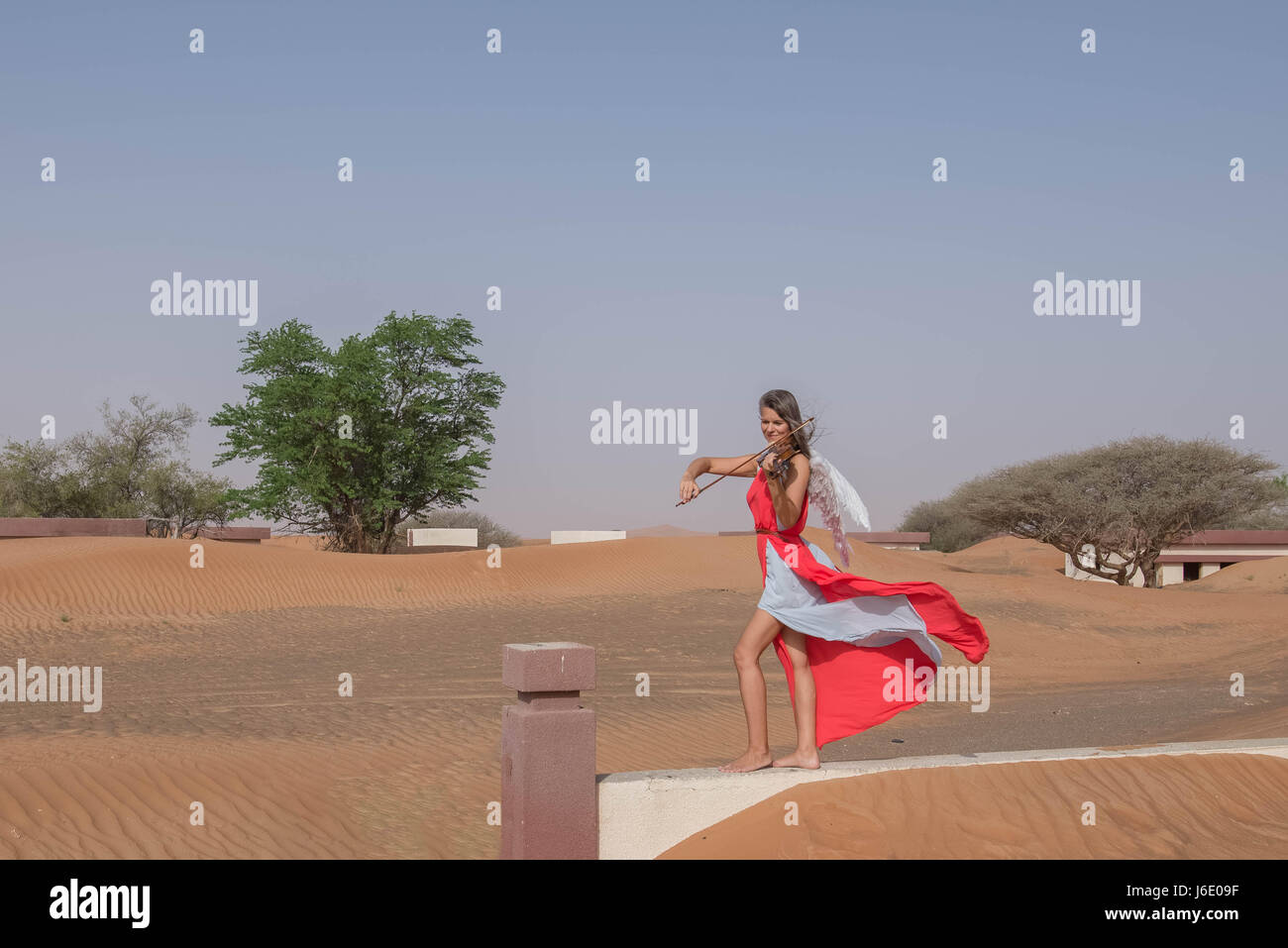 Angel playing violin with passion Stock Photo - Alamy