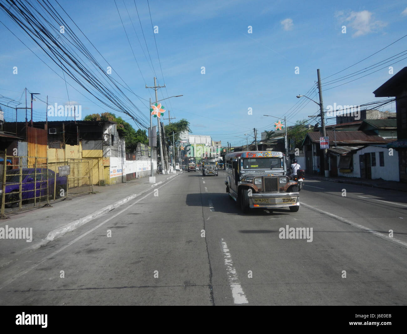 This photograph shows a section of EDSA, a major highway in Metro ...