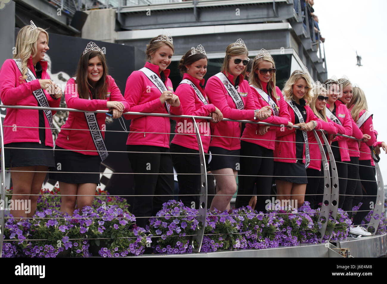 Members of the 2013 Indy 500 Festival Princesses watch as Tony Kanaan ...