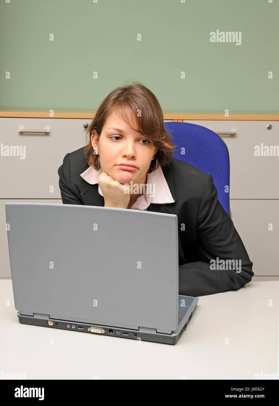 woman office desk listless overwrought unmotivated motivation computers ...