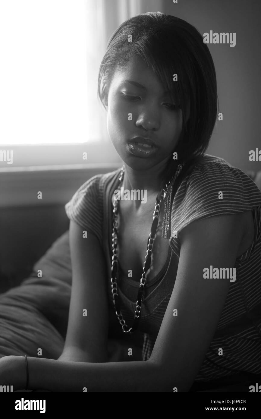 female portrait African depression serious thinking alone lonely woman ...