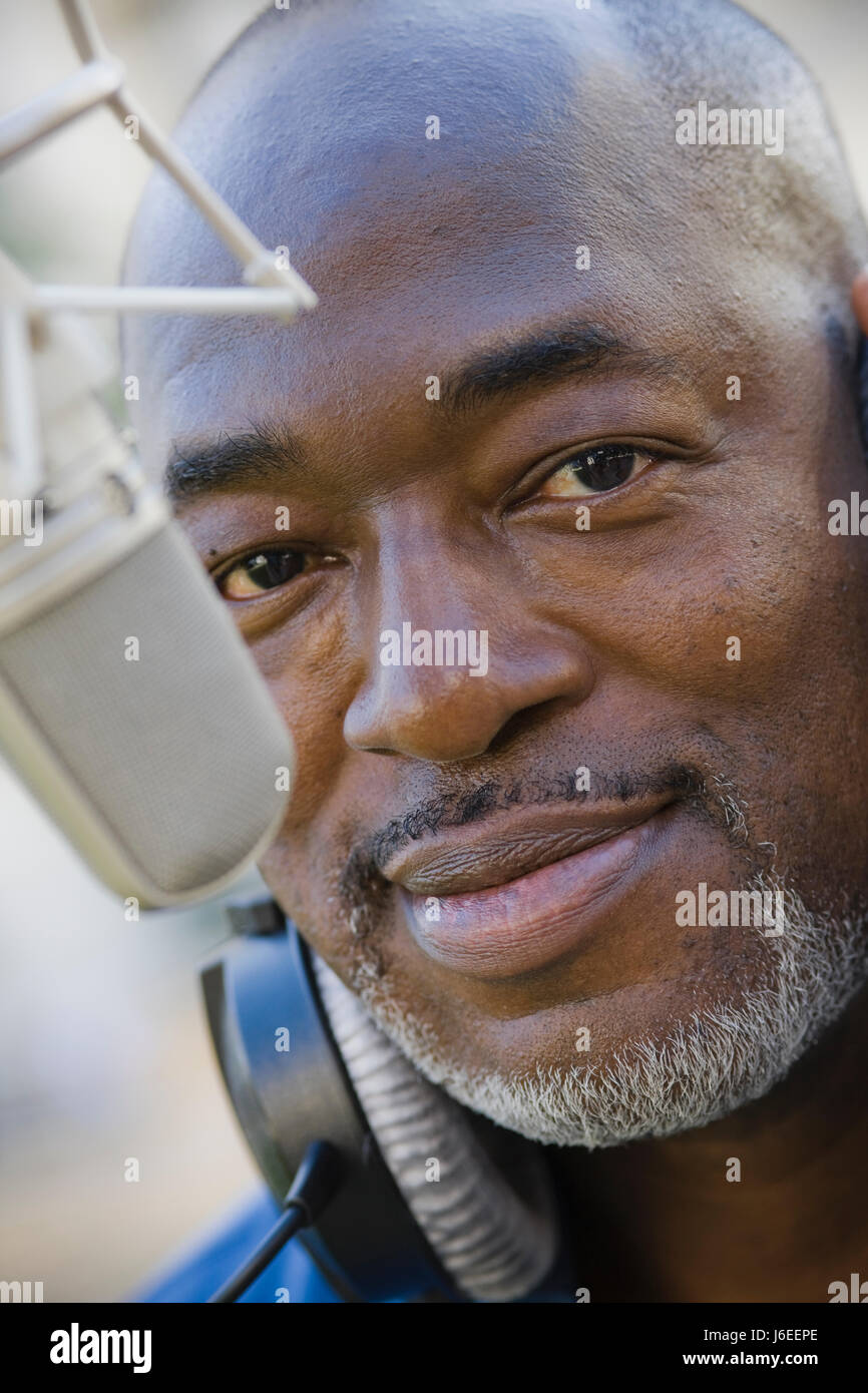 music earphones headphones microphone man blue humans human beings ...