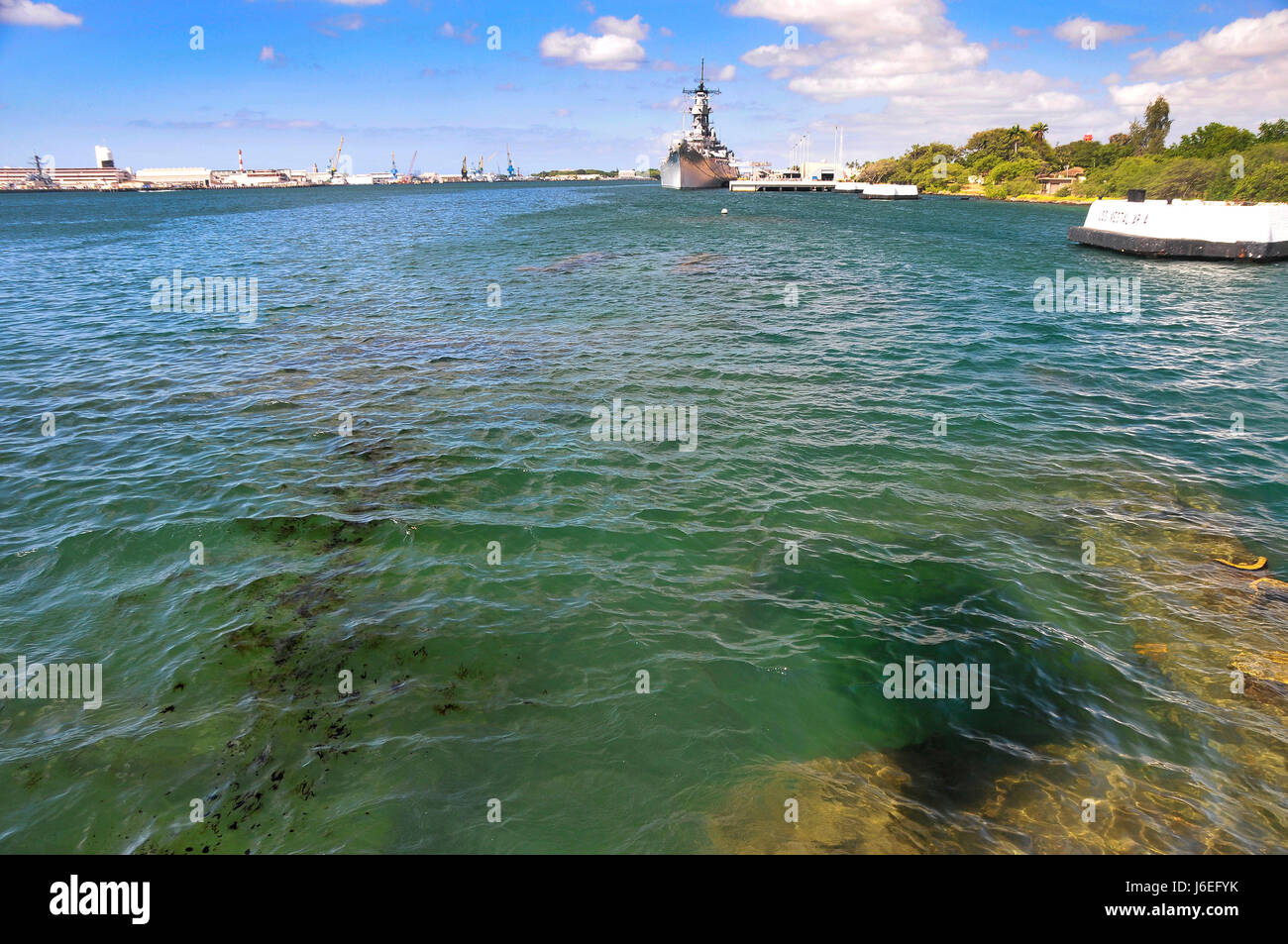 The USS Arizona battleship sits just below the surface of the water ...