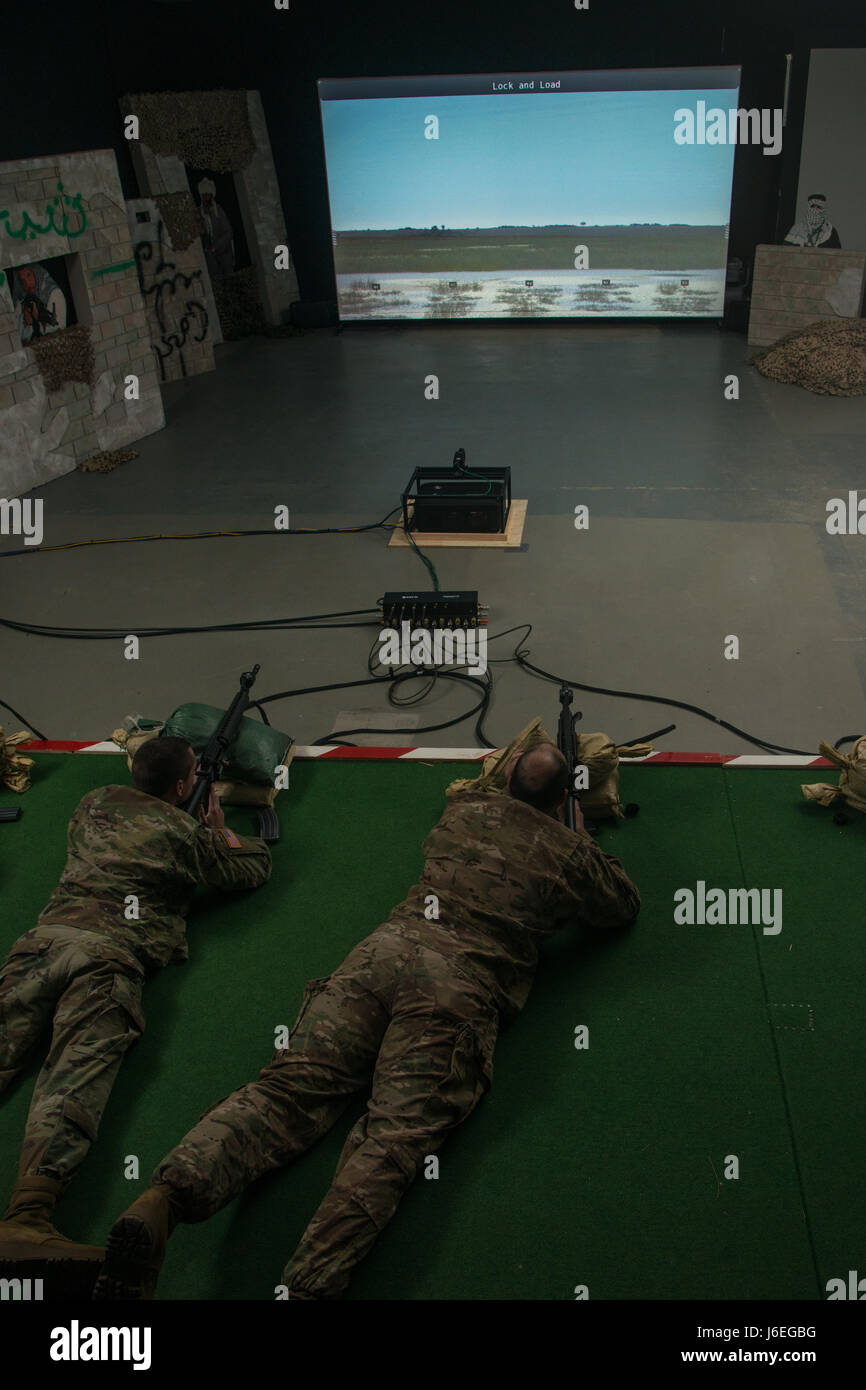 U.S. Soldiers train using the Engagement Skills Trainer II, EST II, at ...