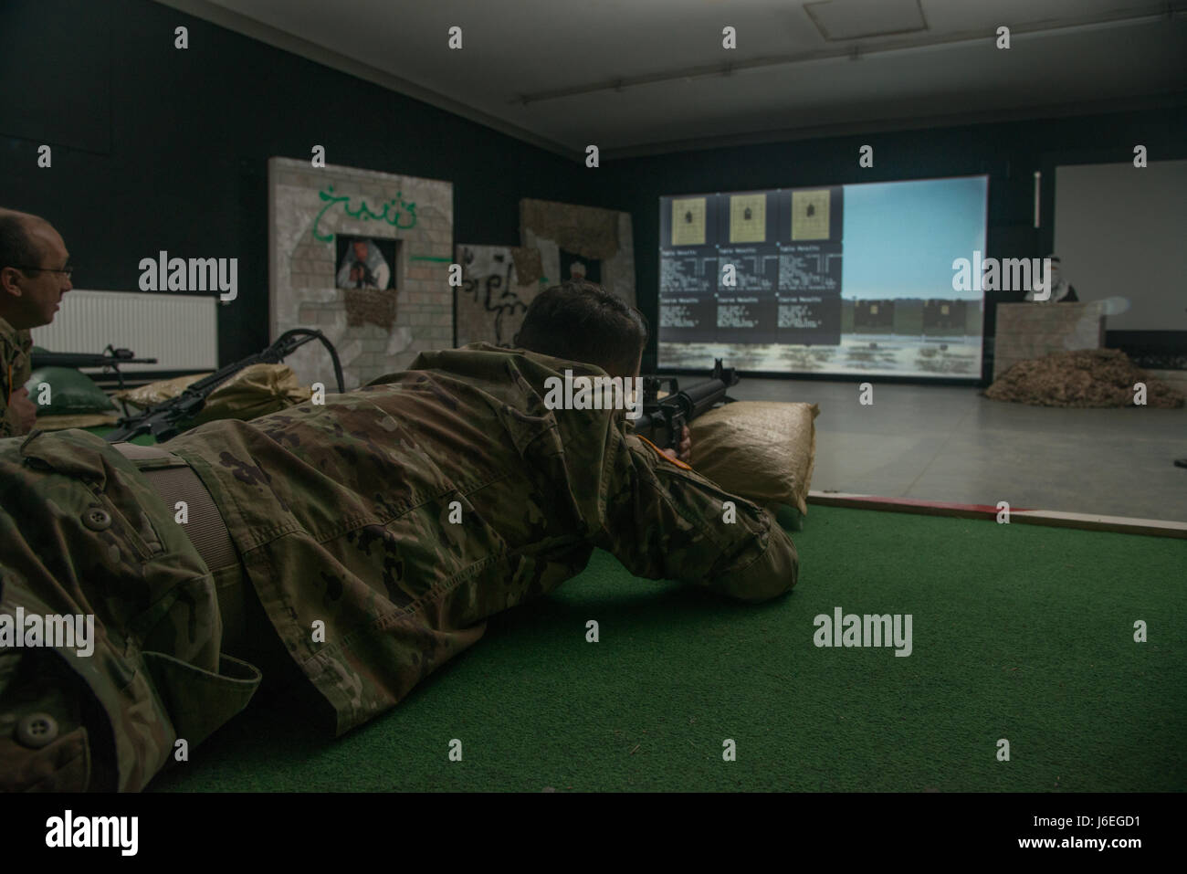 U.S. Soldiers train using the Engagement Skills Trainer II, EST II, at ...